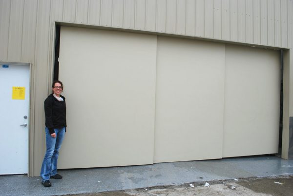Giant Sliding Factory Door | Non-warping patented wooden pivot door ...